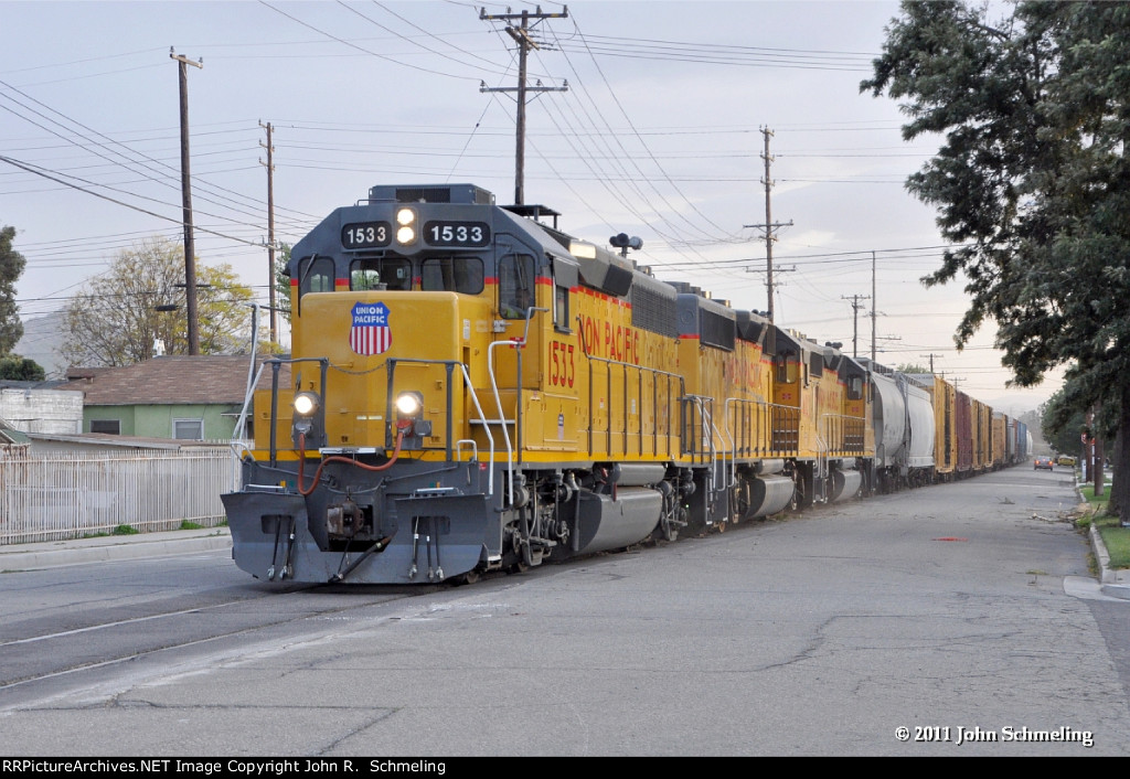 UP 1533 (GP40-2) leads the Riverside Local down 9th Ave in Colton Ca. At this point the local is ...